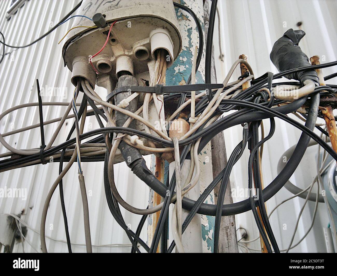 Electric wires are strung up in a dangerous and risky manner Stock ...