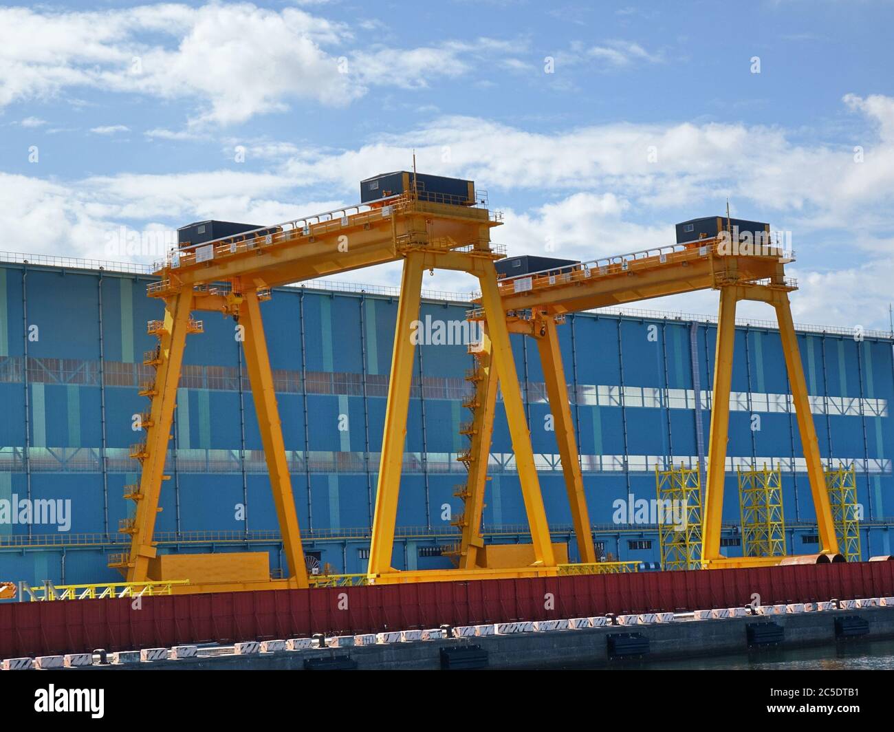 Two large gantry cranes. The Chinese writing says, Safety First Stock ...