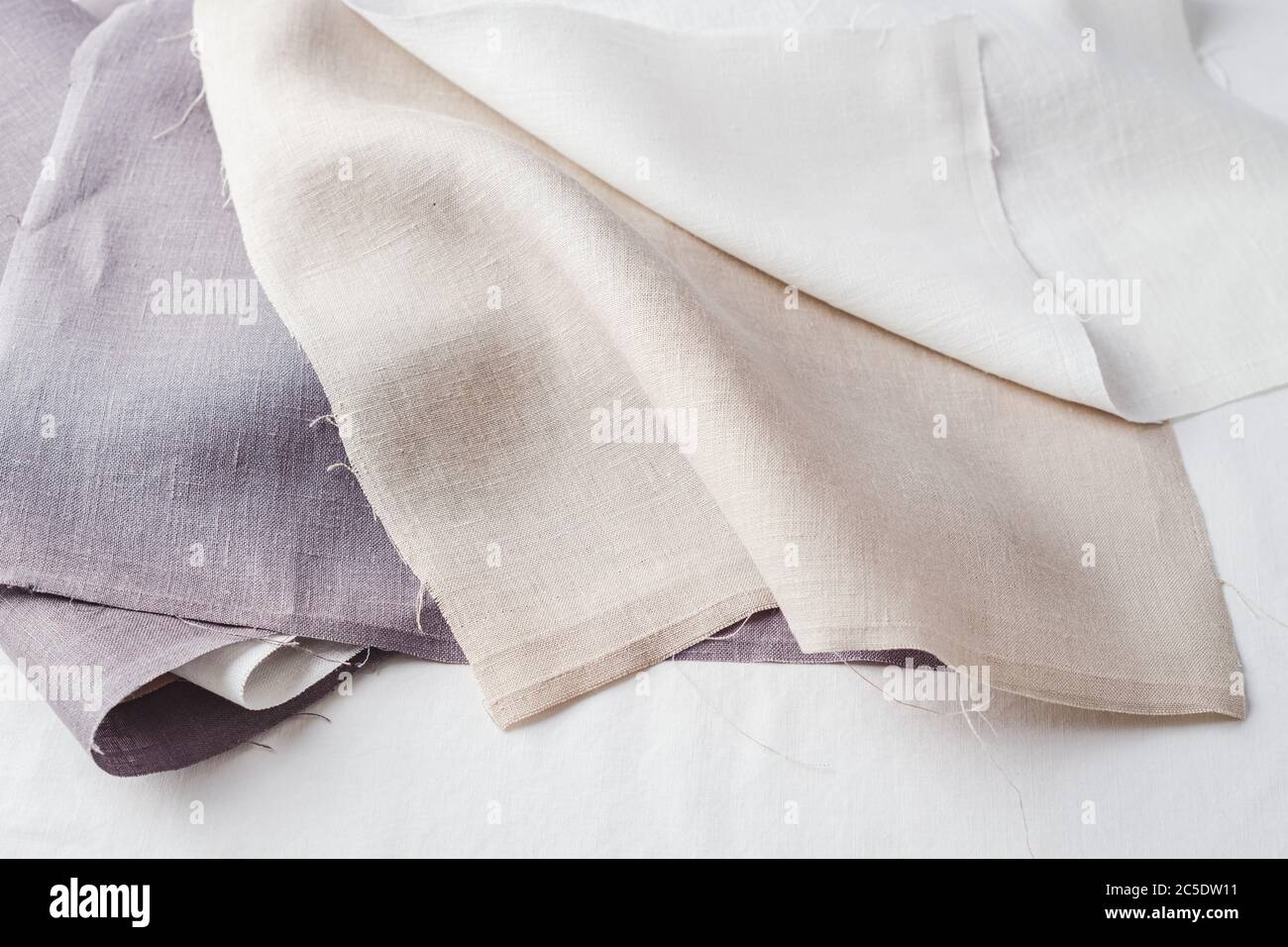 Linen fabric in three natural colors as a background Stock Photo - Alamy