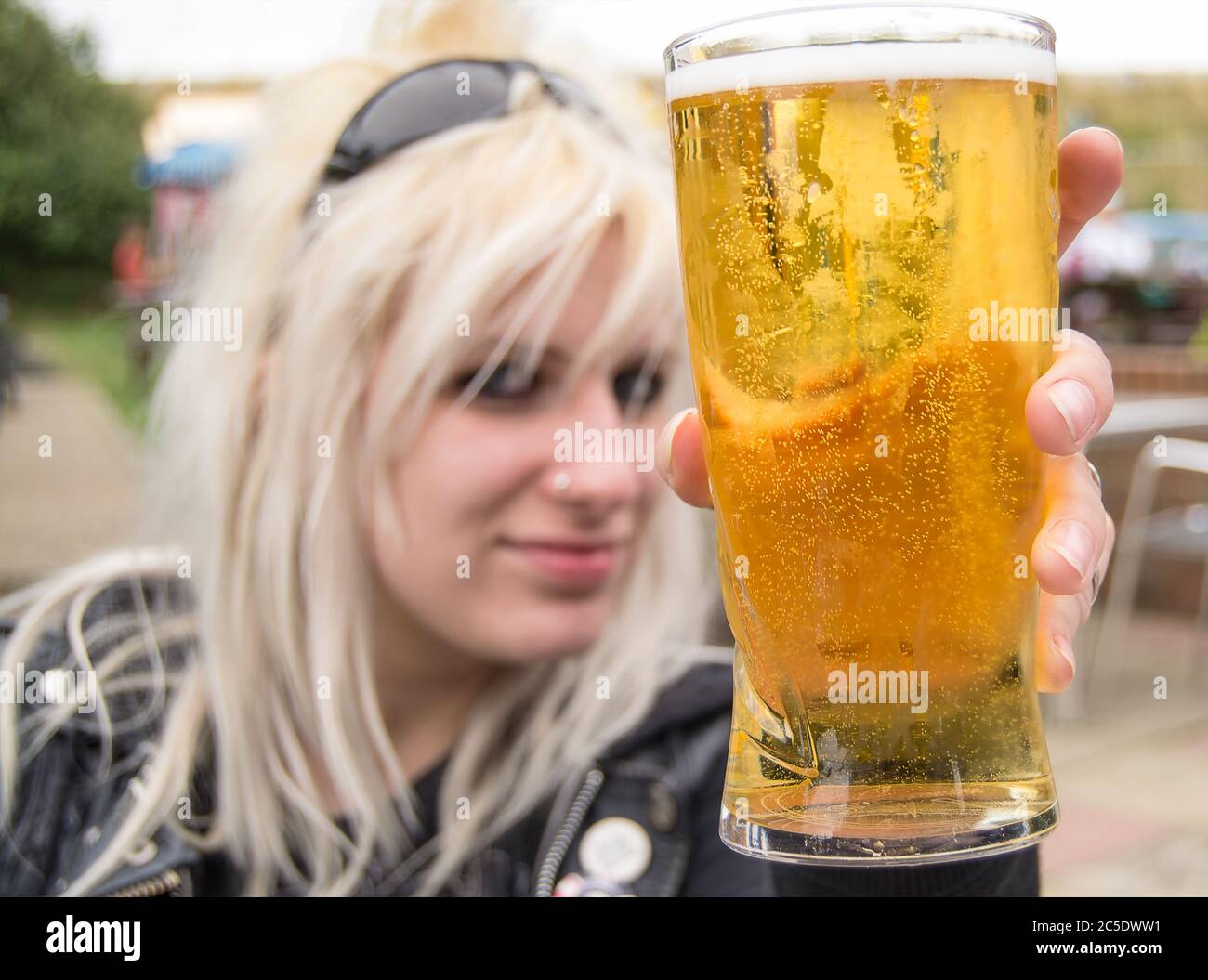 Blonde girl drinking beer hi-res stock photography and images - Alamy