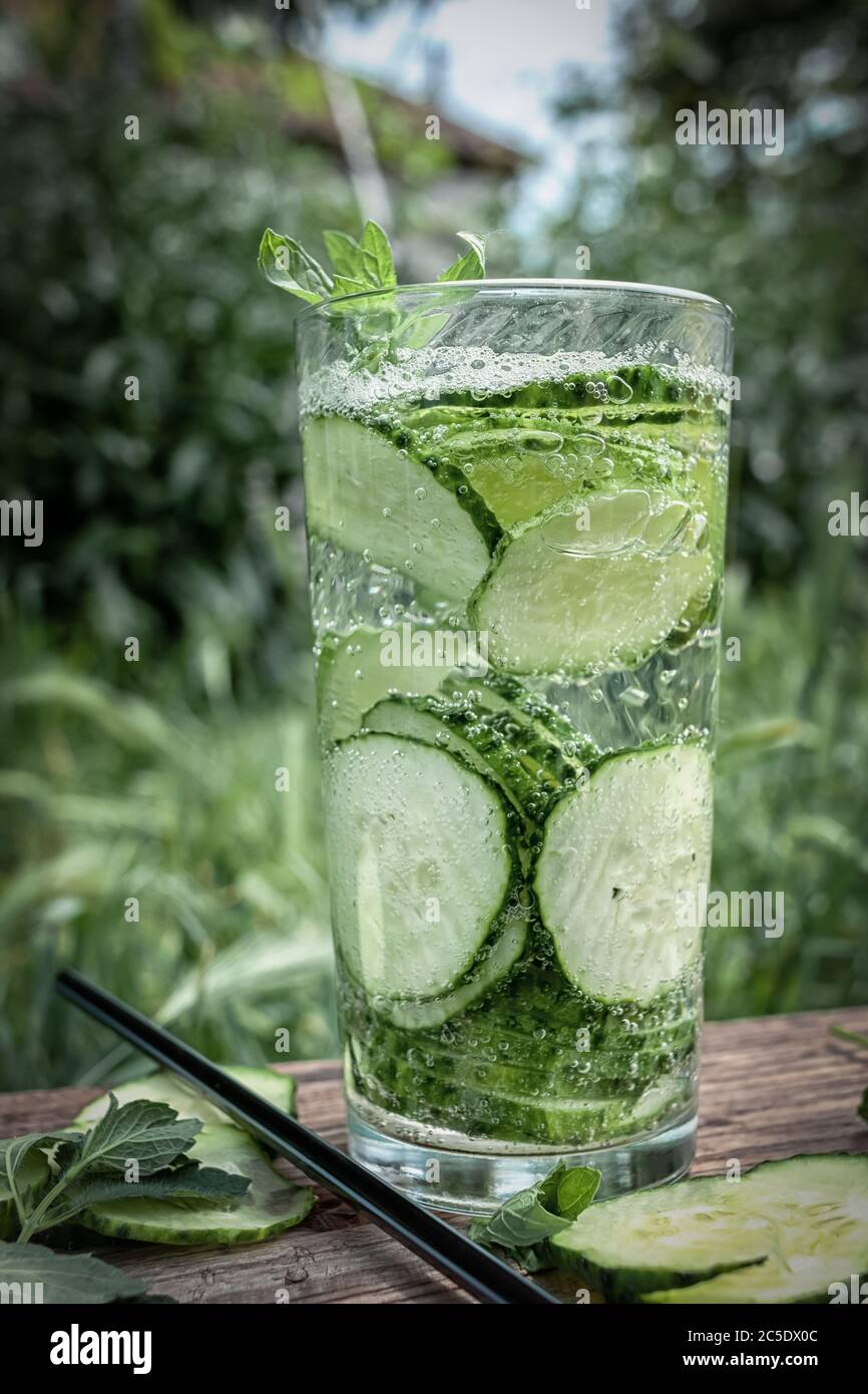 A cool, refreshing drink with cucumbers on nature on a hot day Stock ...