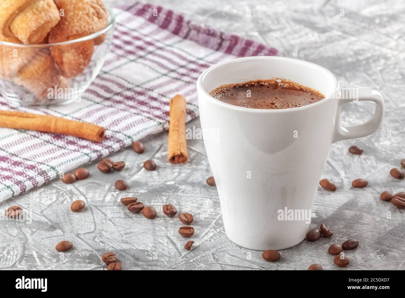 Coffee with cream and freshly baked puffs on a gray background Stock ...