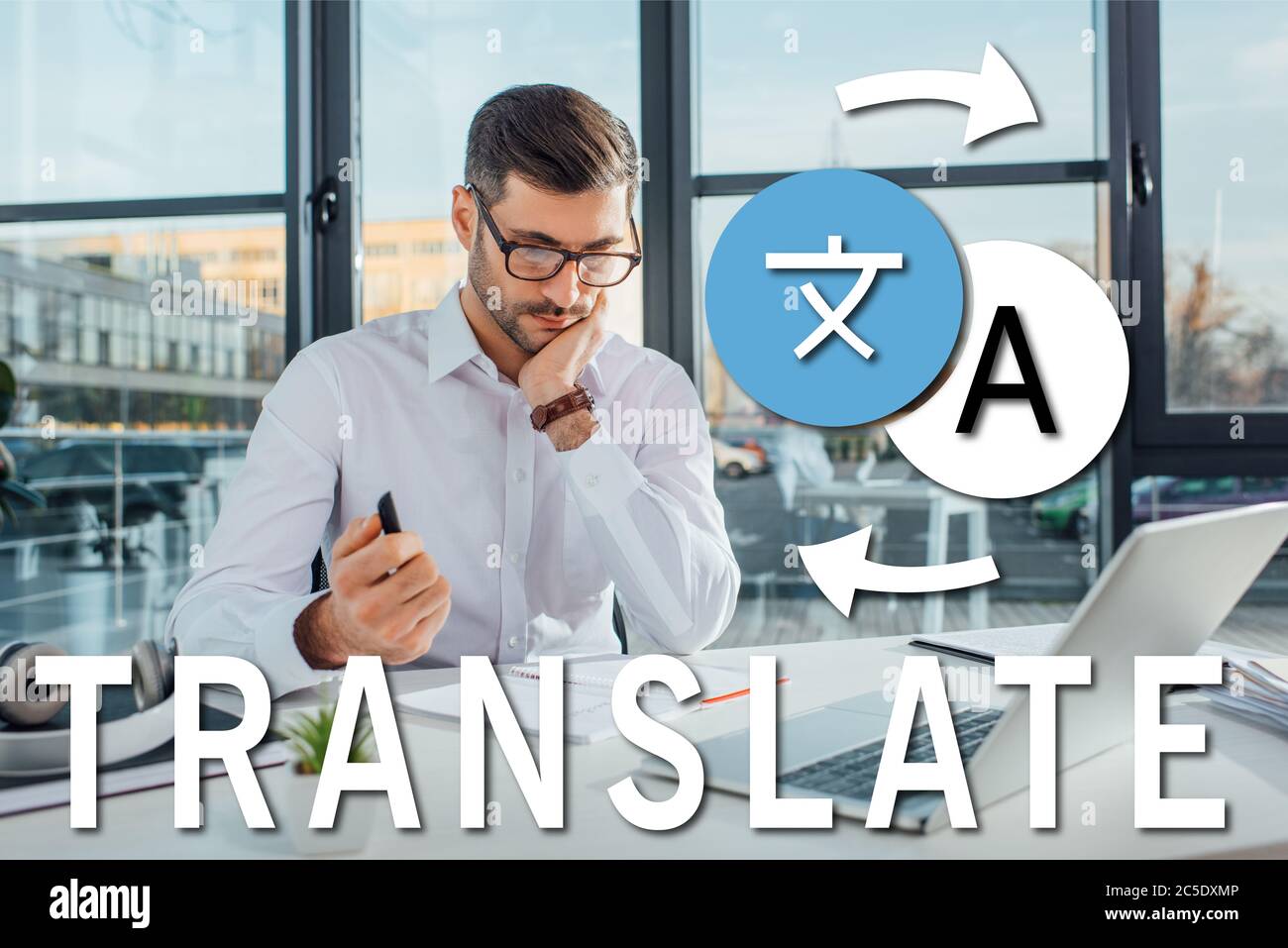 professional translator in eyeglasses working online with laptop ...
