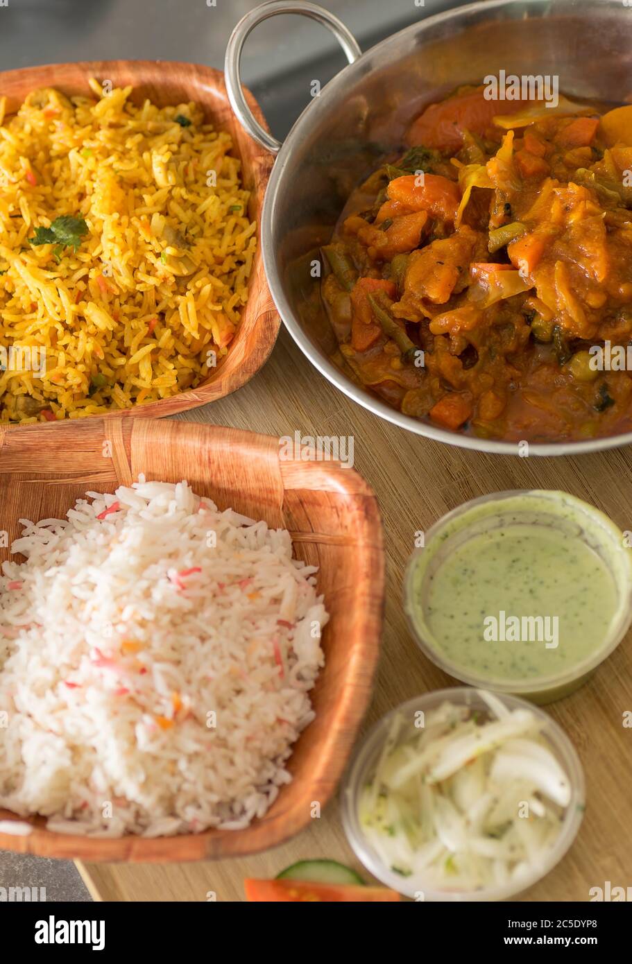 Indian cuisine, vegetable pathia served with rice Stock Photo - Alamy