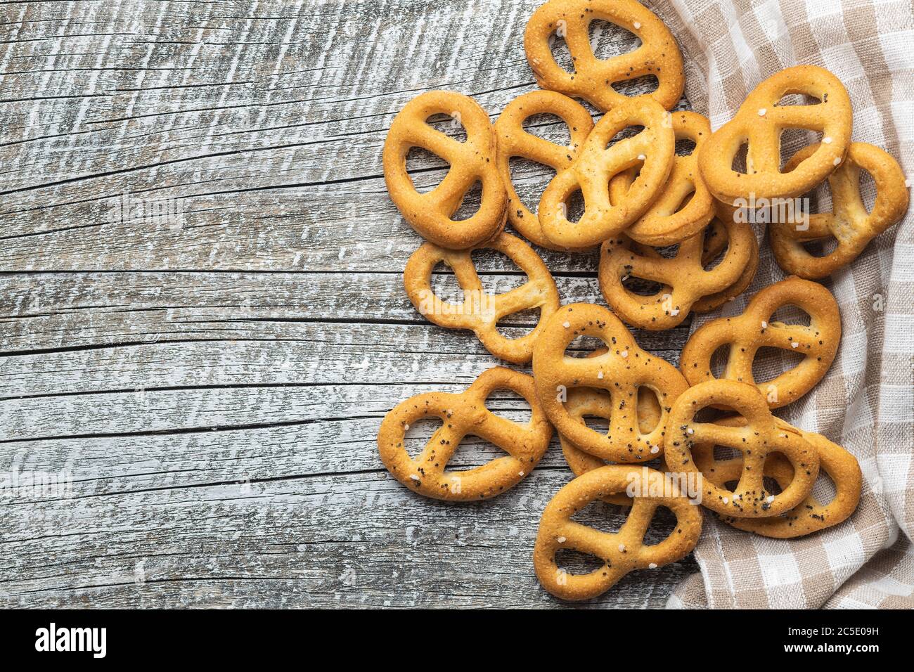Crispy salted pretzels on wooden table. Top view Stock Photo - Alamy
