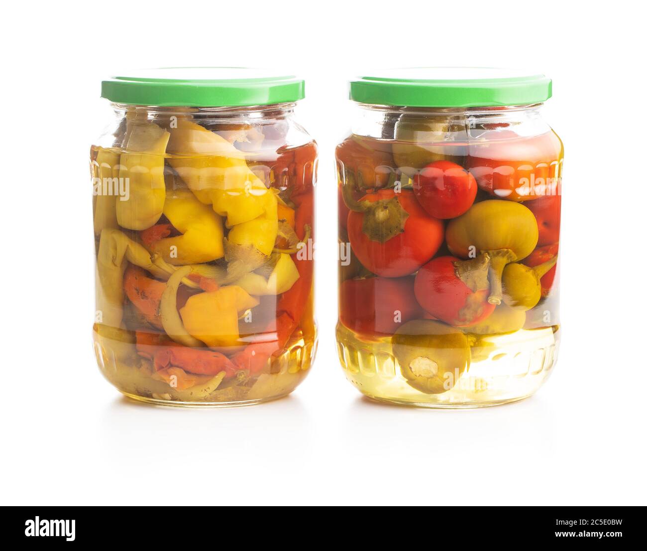 Round chili peppers. Green and red pickled peppers in jar isolated on ...
