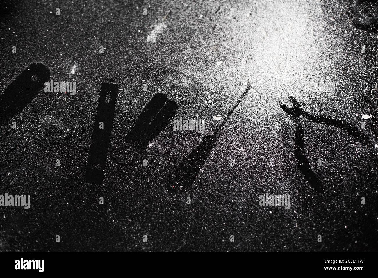 Traces of tools on a black table dusted with white dust Stock Photo - Alamy