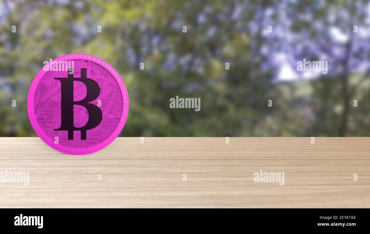 Pink bitcoin gold coin on wood wooden table over forest trees blur. bit ...