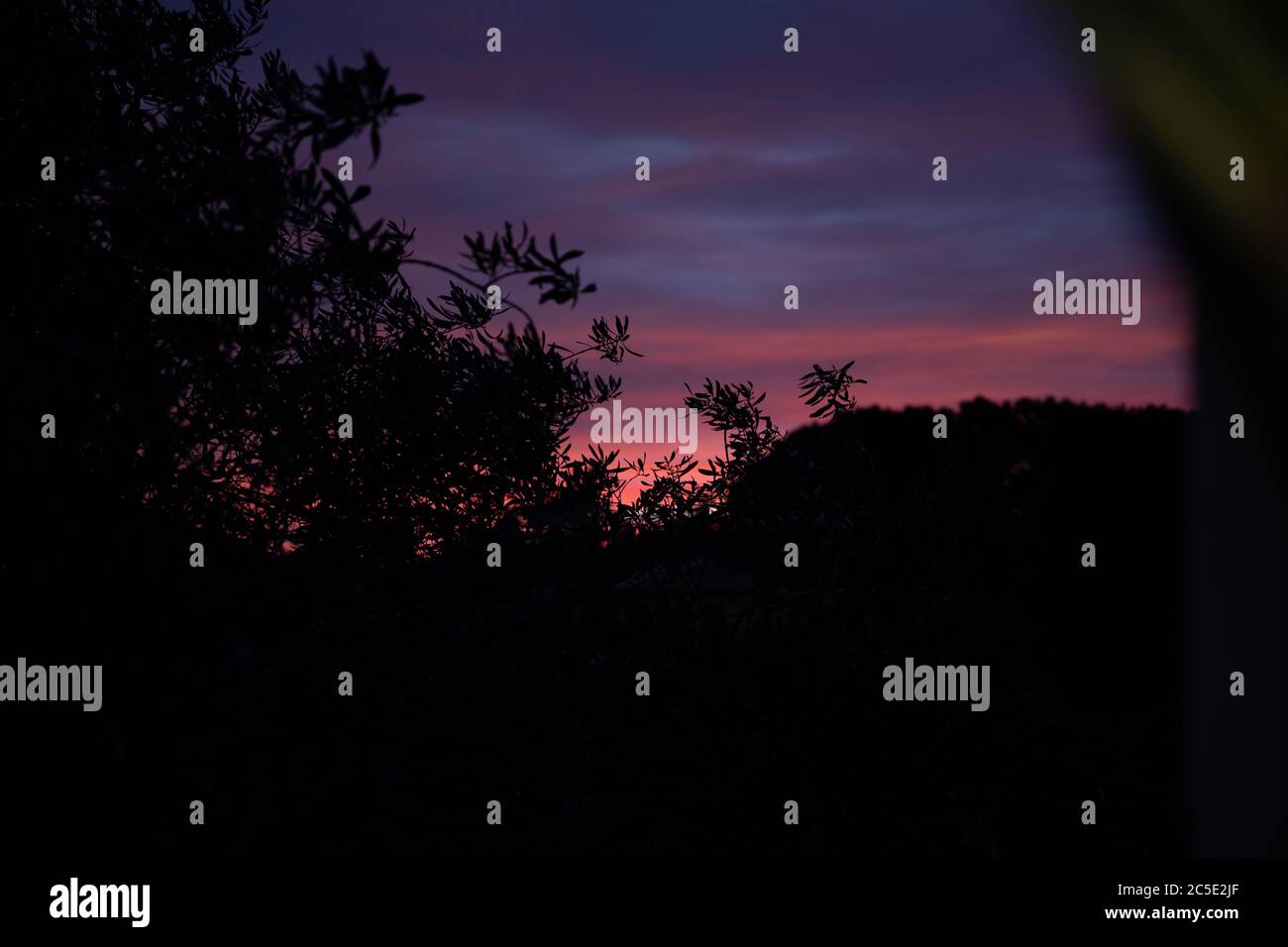 Early morning behind mountains, dark landscape, sunset sky Stock Photo ...