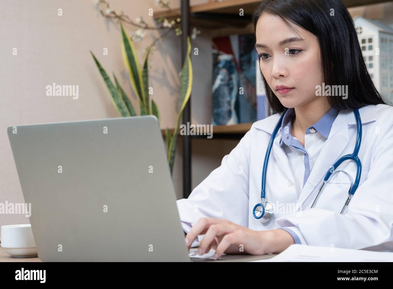 Asian female doctor video hi-res stock photography and images - Alamy