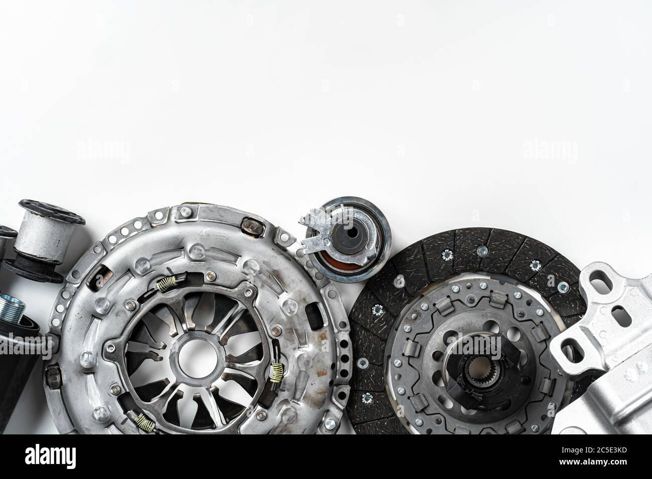 New metal auto parts on grey background Stock Photo - Alamy