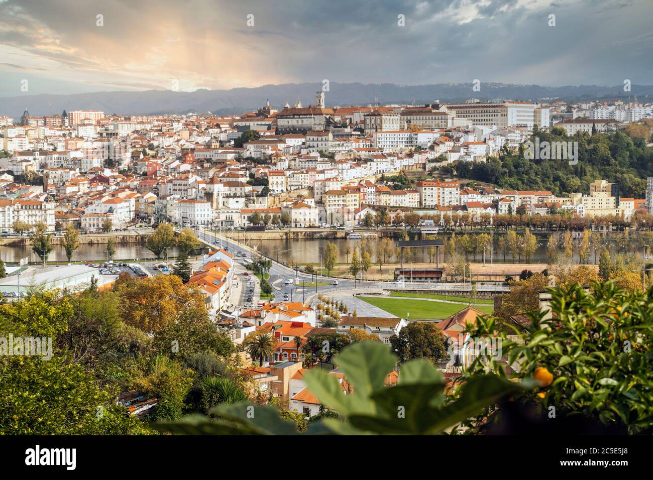 Beautiful cityscape of historic Coimbra with garden in the foreground ...
