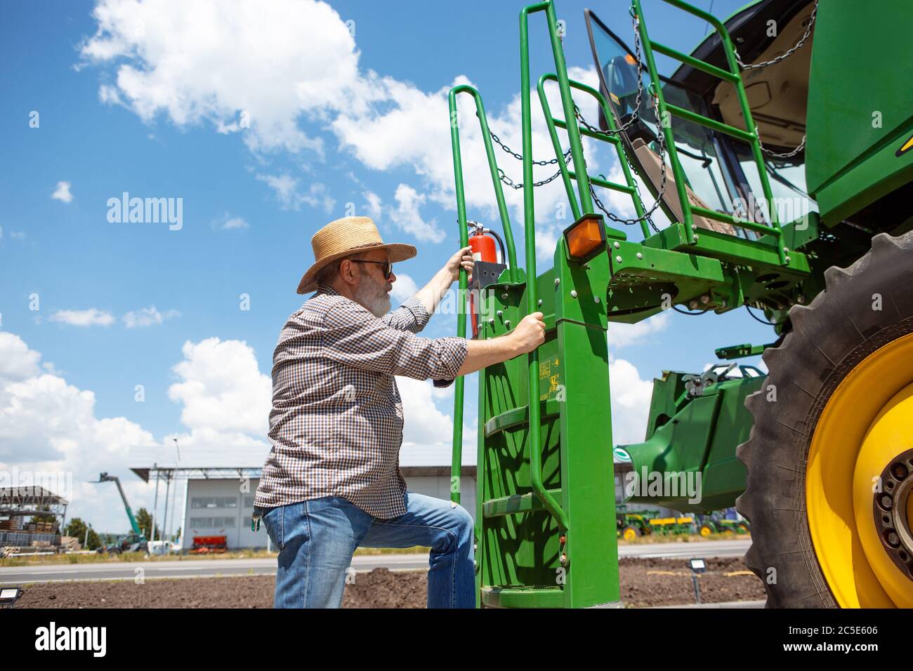 Farmer climbing tractor hi-res stock photography and images - Alamy
