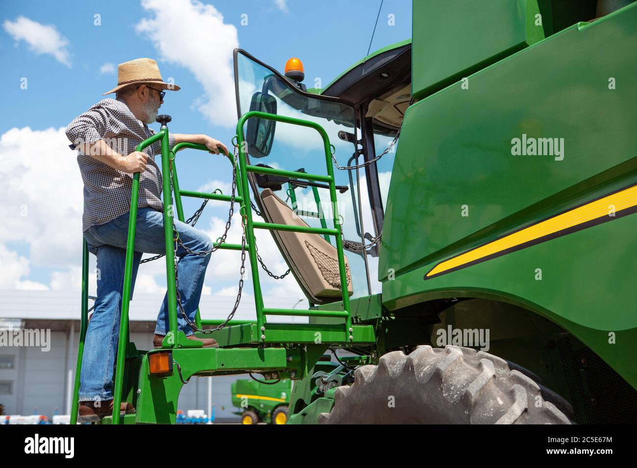 Farmer climbing tractor hi-res stock photography and images - Alamy
