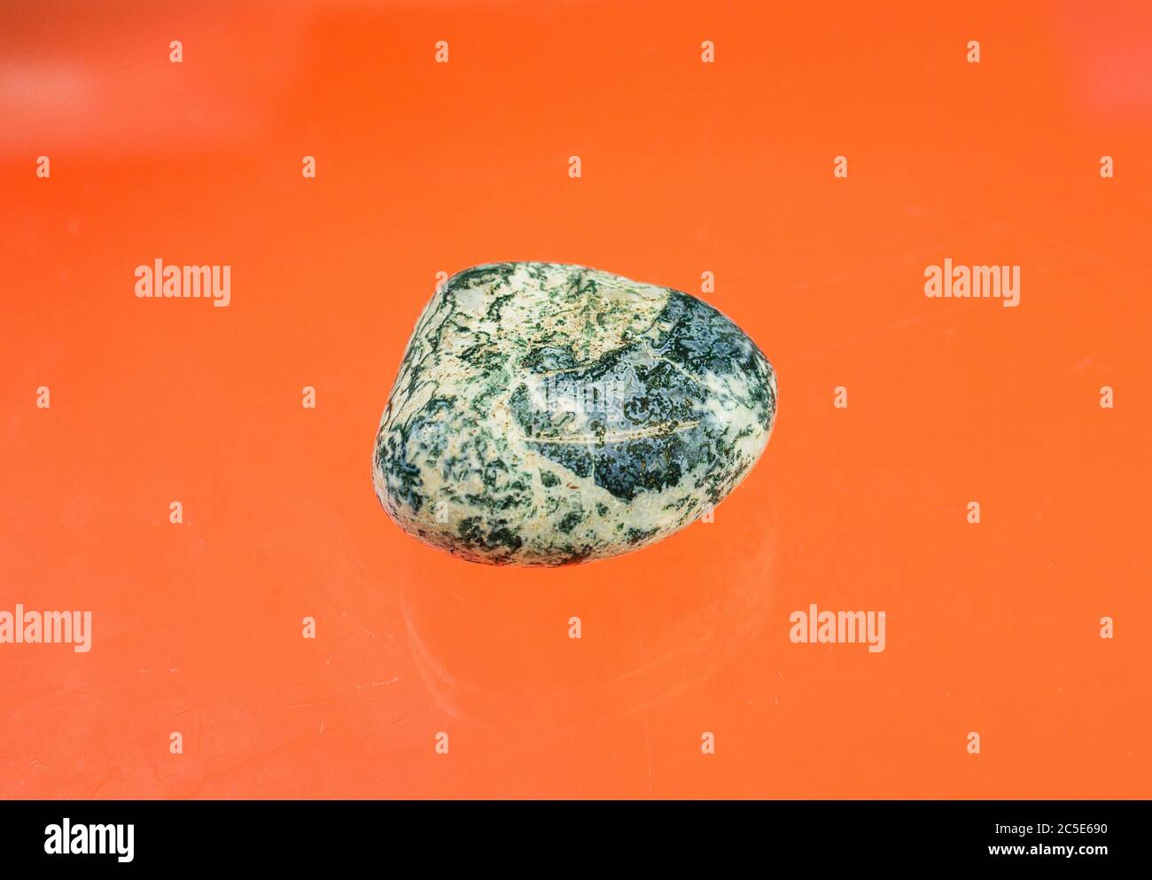 white agate with green inclusions and a smooth surfaceing stone Stock ...