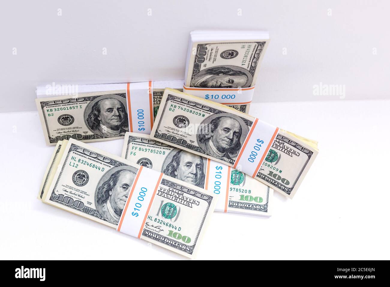 Colection of packs of dollars isolated on white background Stock Photo ...