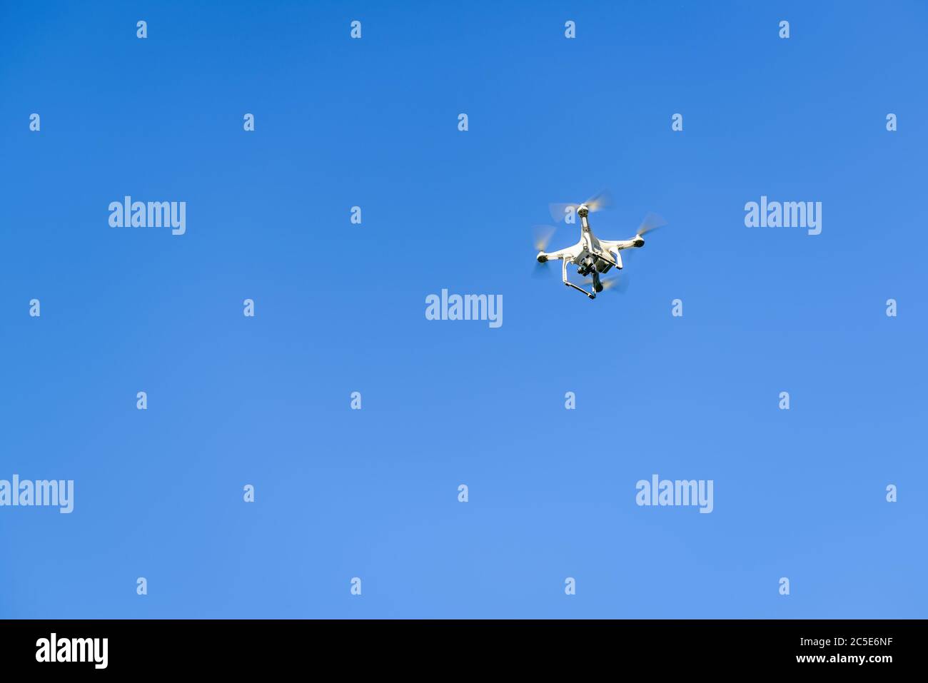 Drone quad copter with onboard high resolution digital camera flying in ...