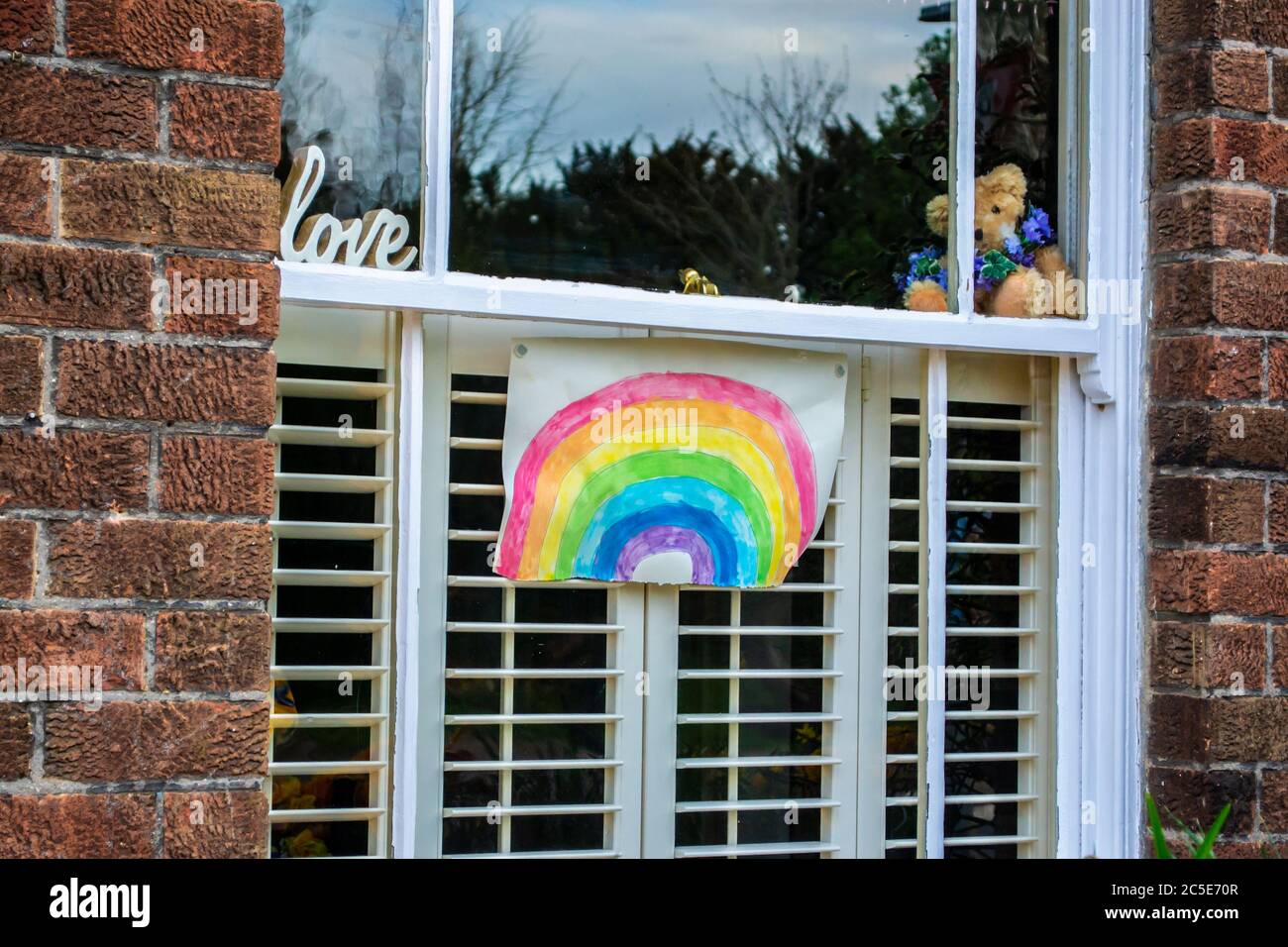 Rainbow drawing in a window- as a sign of hope during the 2020 ...