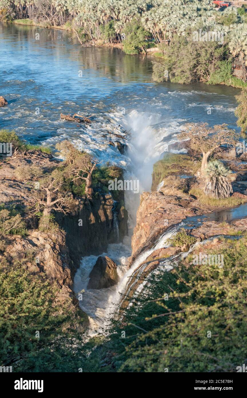 Part of the Epupa waterfalls in the Kunene River. Baobab and makalani ...