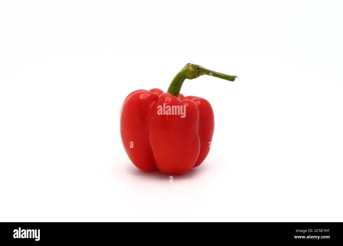 One red ripe bell pepper on a light background. Natural product ...