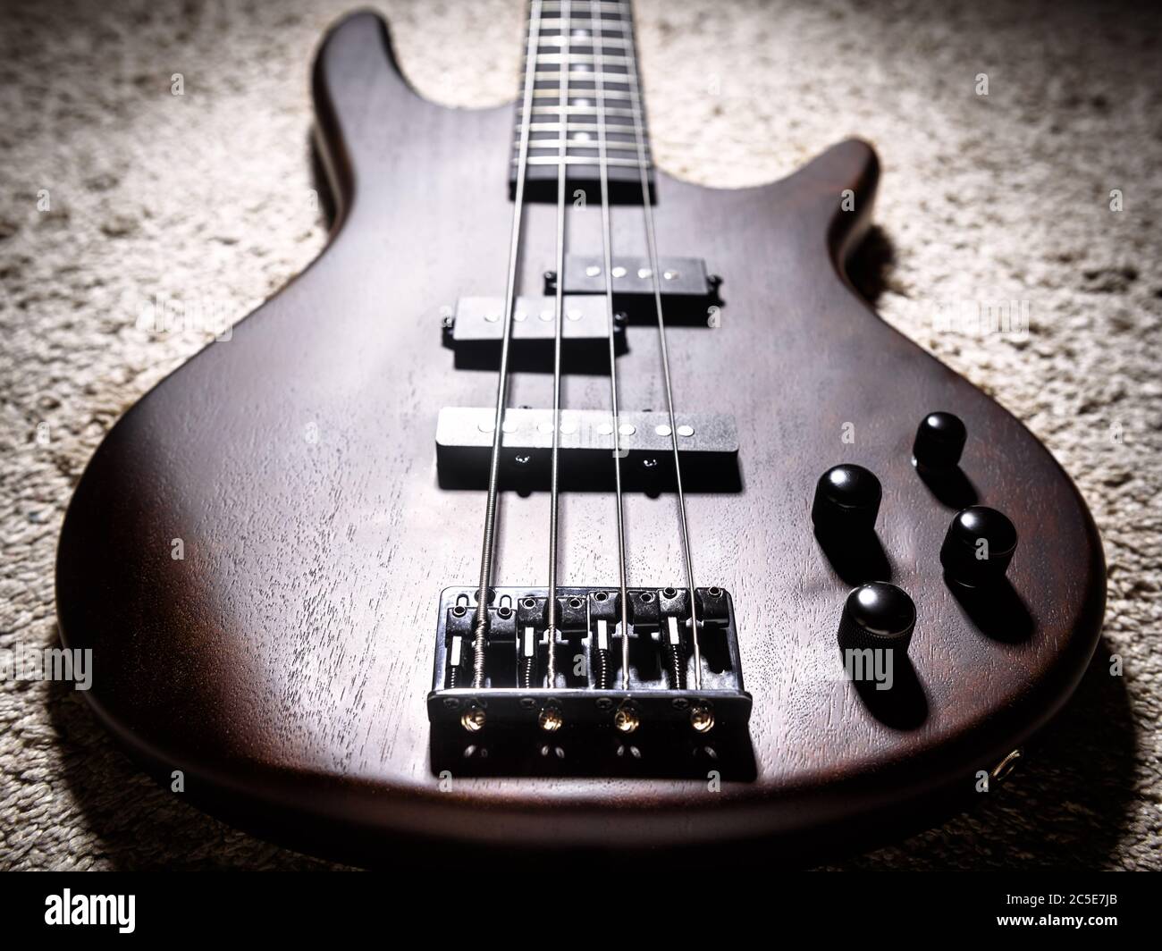 Bass electric guitar with four strings closeup. Popular rock musical ...