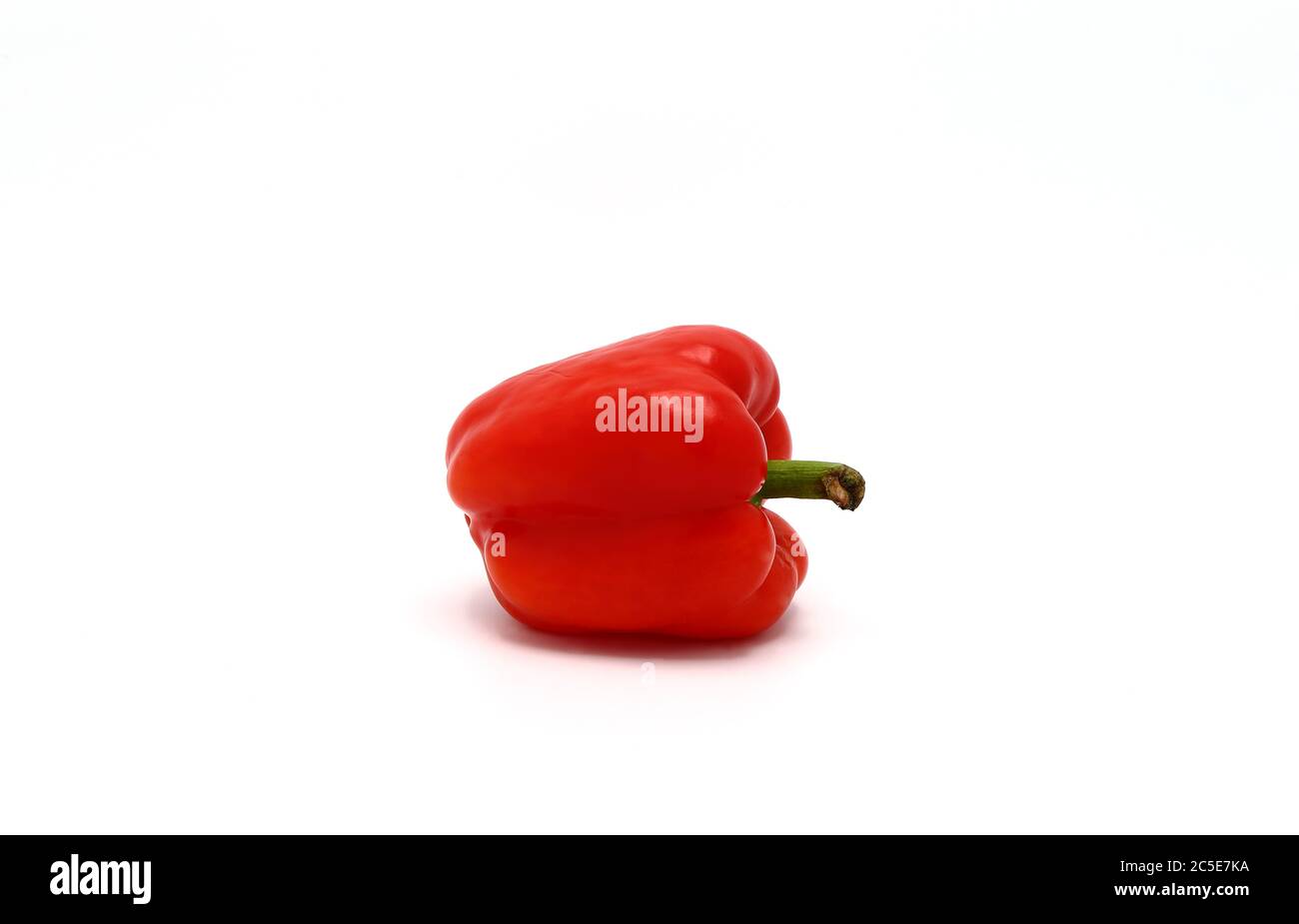 One red ripe bell pepper on a light background. Natural product ...