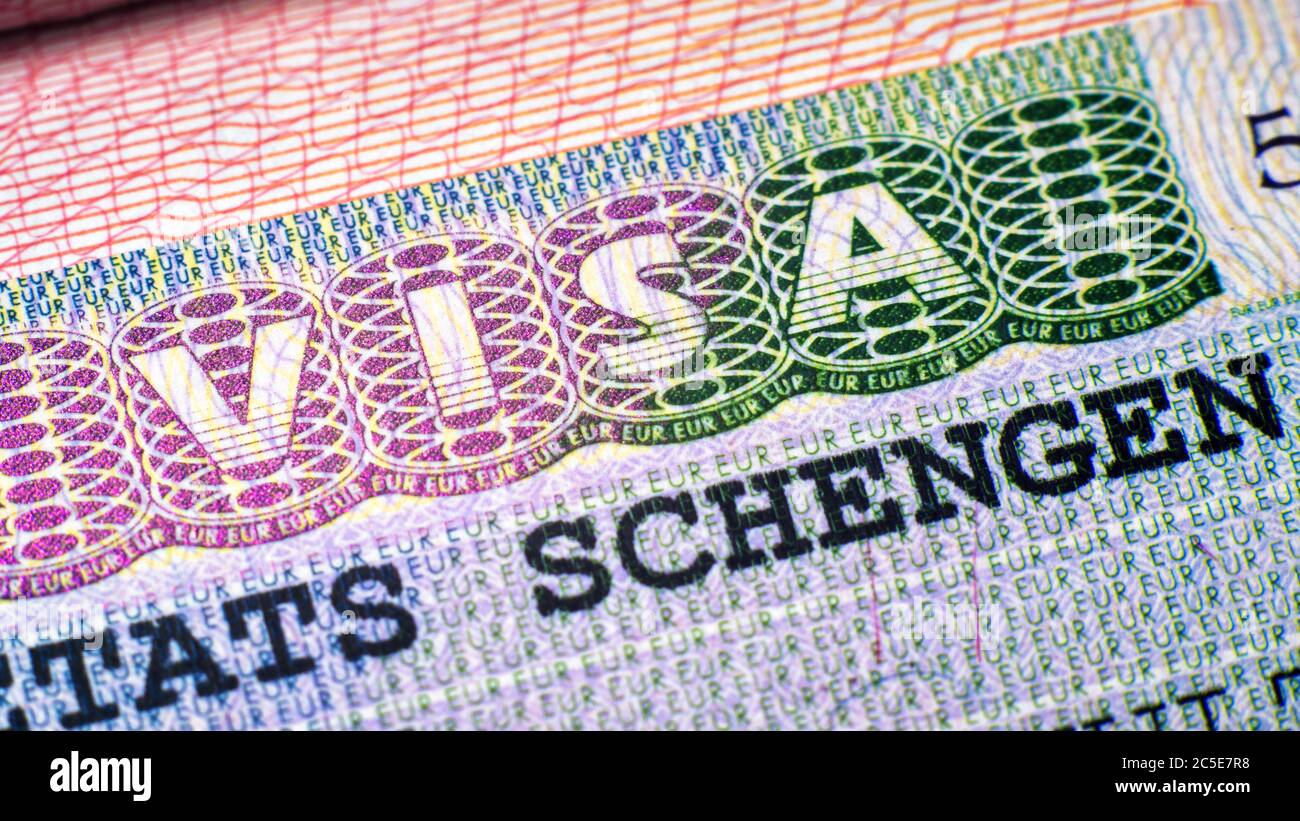Visa stamp in passport closeup. European visitor visa at border control ...