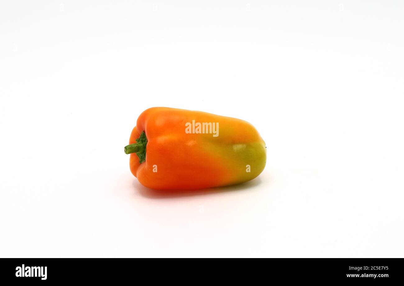 Orange ripe bell peppers on a light background. Natural product ...