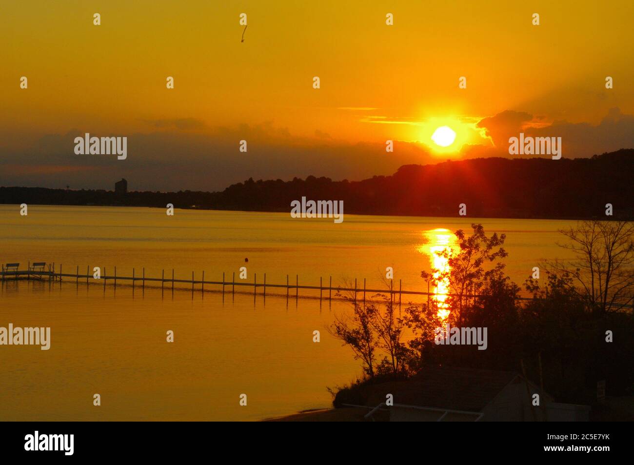 Golden sunset over water in hi-res stock photography and images - Alamy