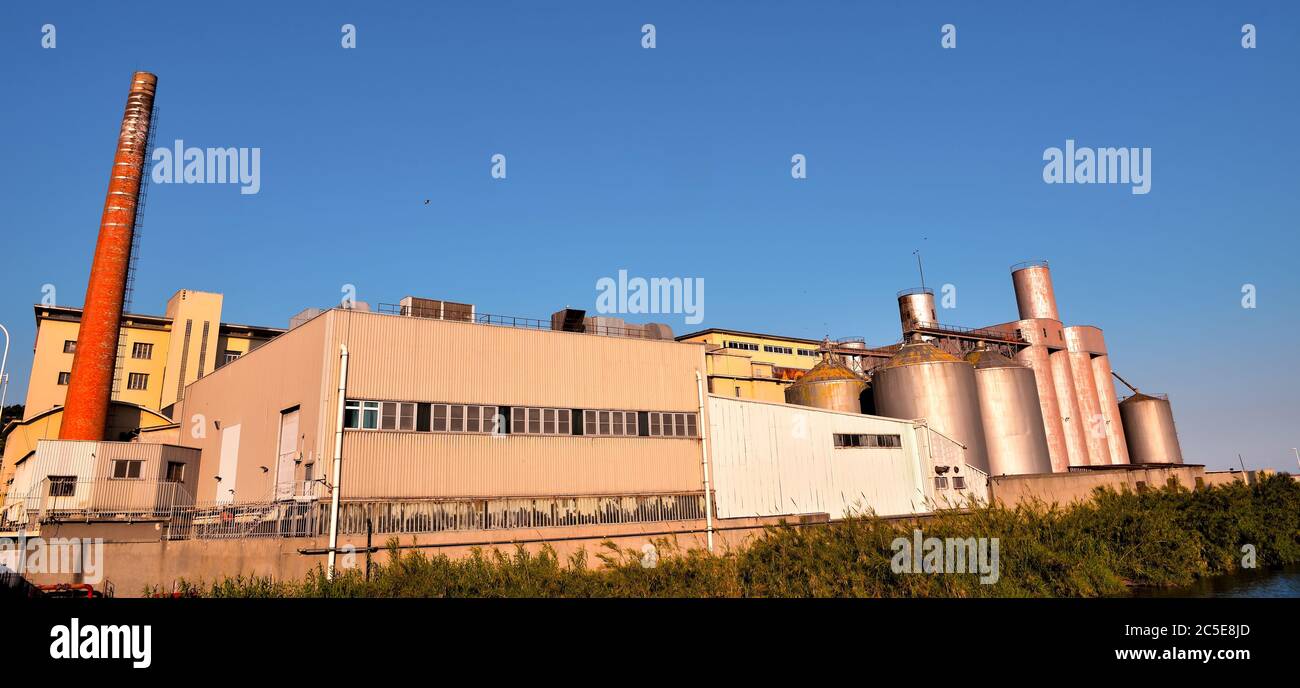 smokestacks of an abandoned pasta factory in Imperia Italy Stock Photo ...