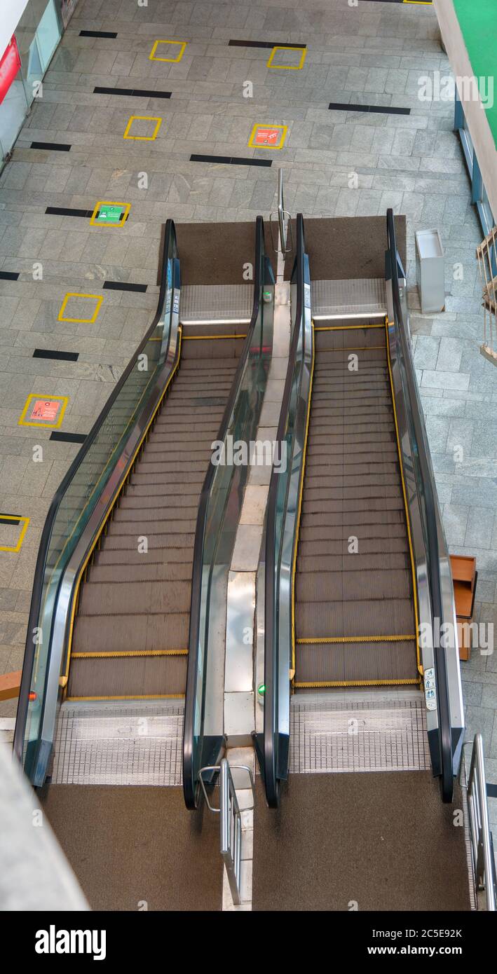 Escalator without people overlooking Boxes made for Social Distance ...
