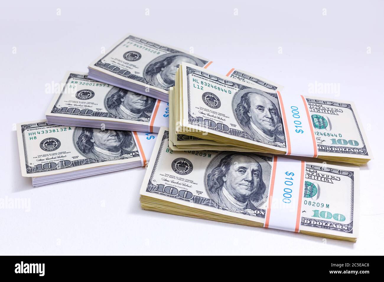 Set of a packs of dollars with a rubber band isolated on a white ...