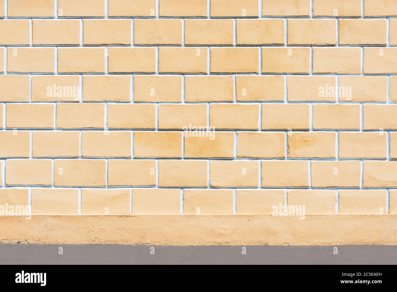 Yellow wall made from concrete of the building exterior Stock Photo - Alamy
