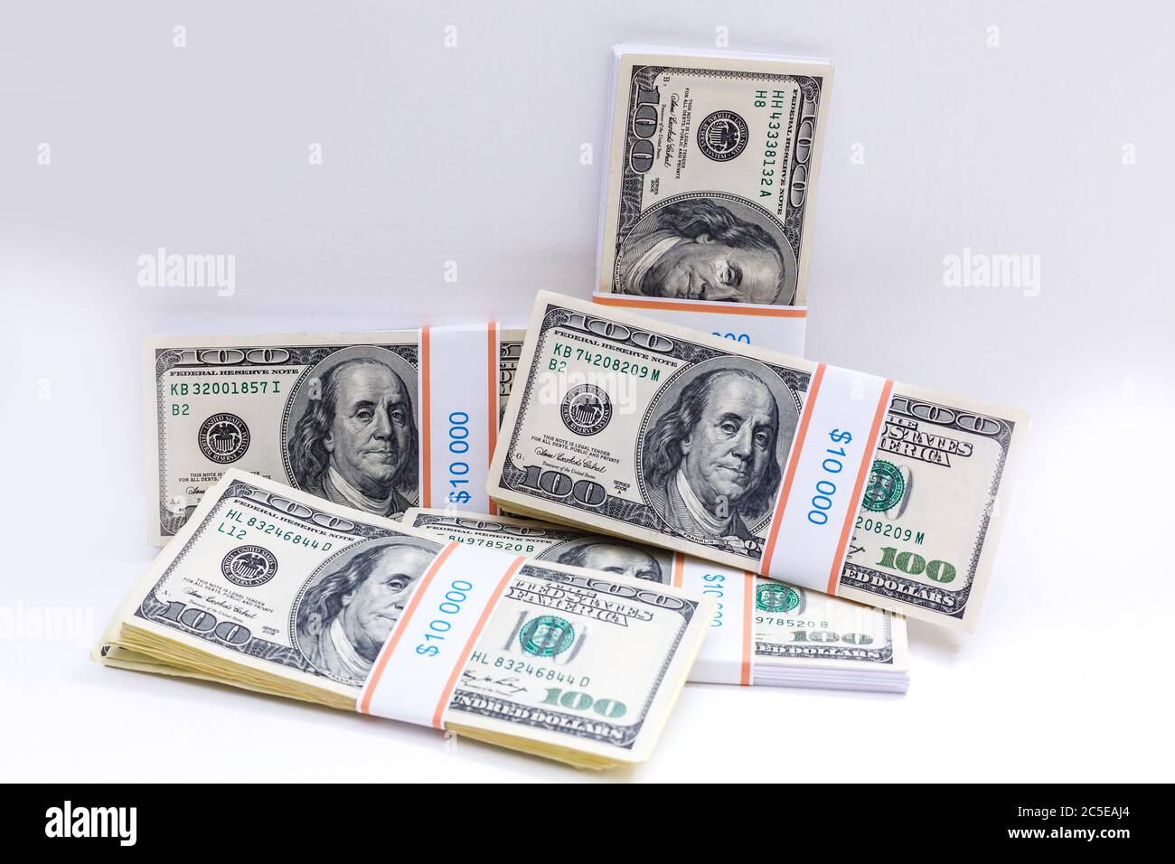 Set of a packs of dollars with a rubber band isolated on a white ...