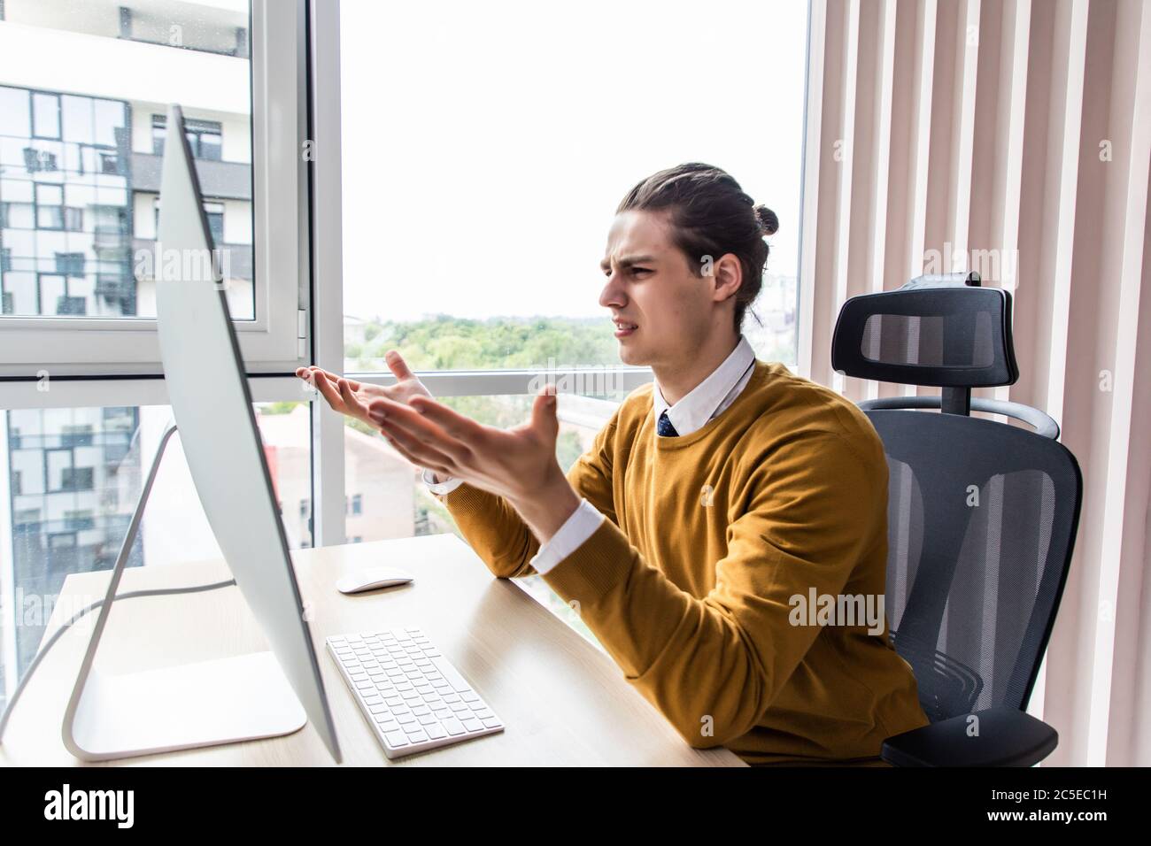 Frustrated angry entrepreneur outraged by pc problem. Furious mad man ...