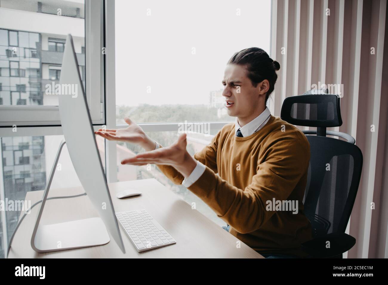 Frustrated angry entrepreneur outraged by pc problem. Furious mad man ...