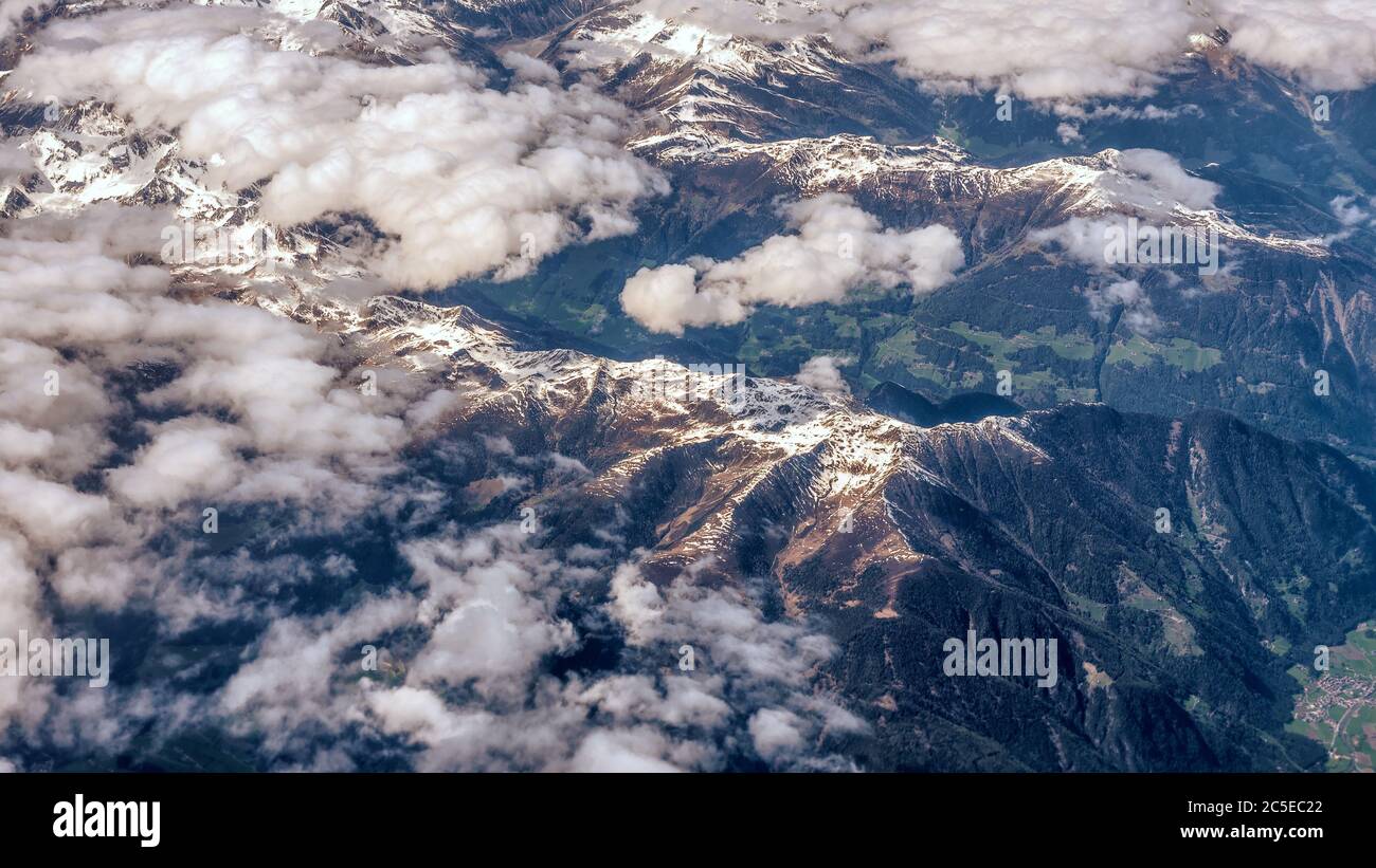 Aerial view of the Alpine mountains from an airplane Stock Photo - Alamy