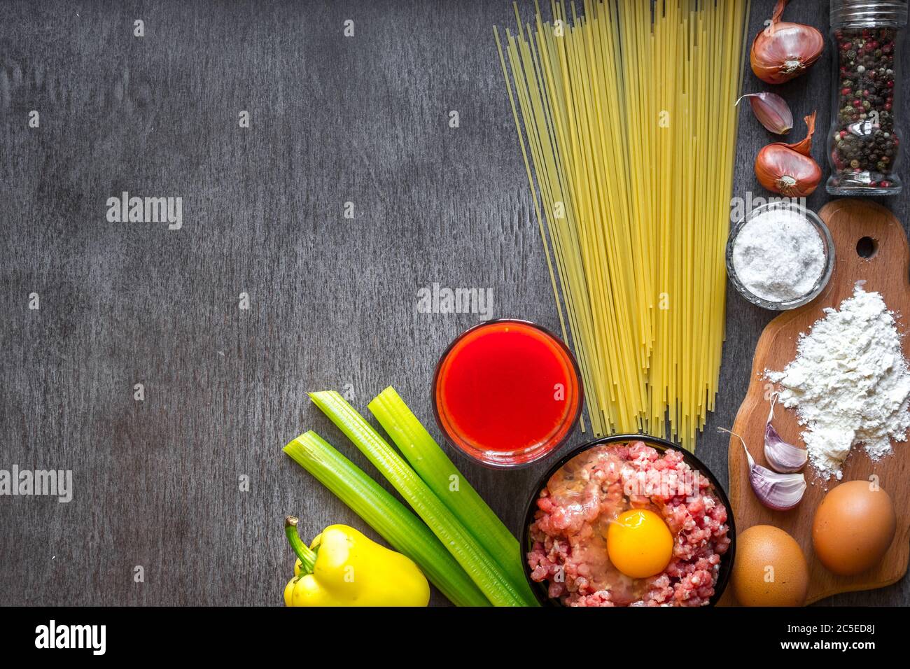 Ingredients for cooking pasta. Spaghetti, tomato juice, olive oil ...