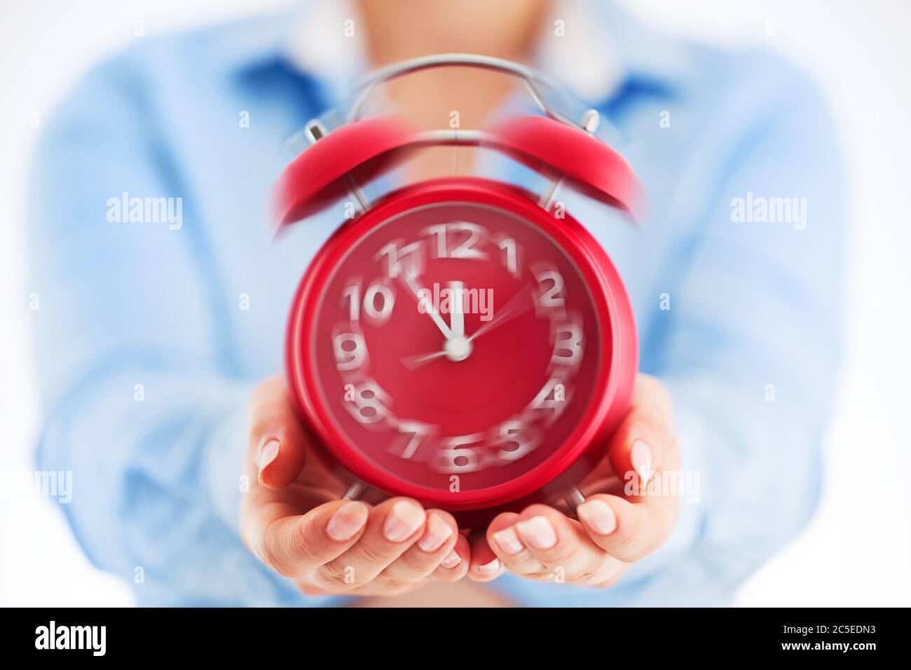 Hands holding clock hi-res stock photography and images - Alamy