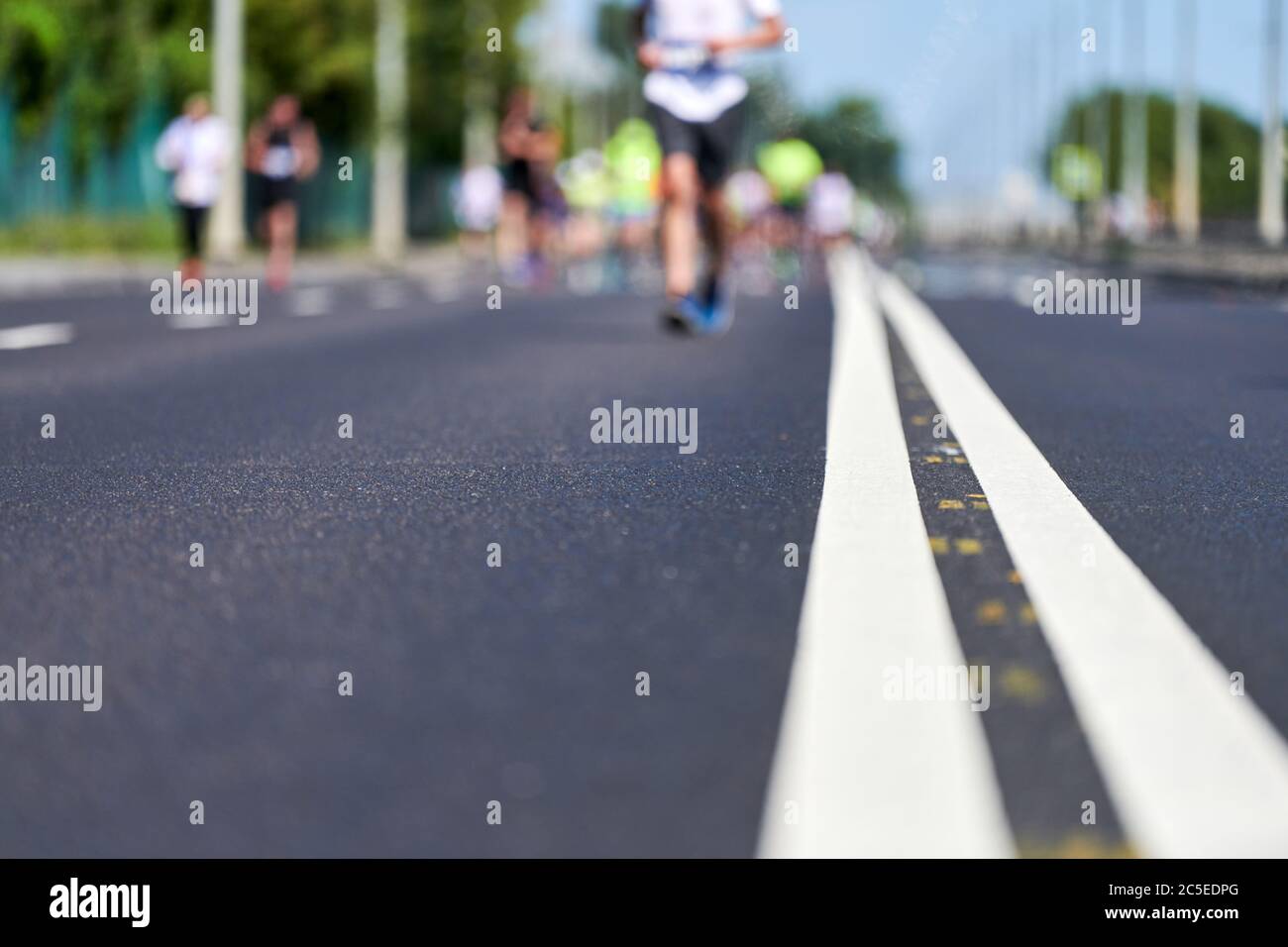 Marathon runners on city road. Running competition, copy space. Street ...