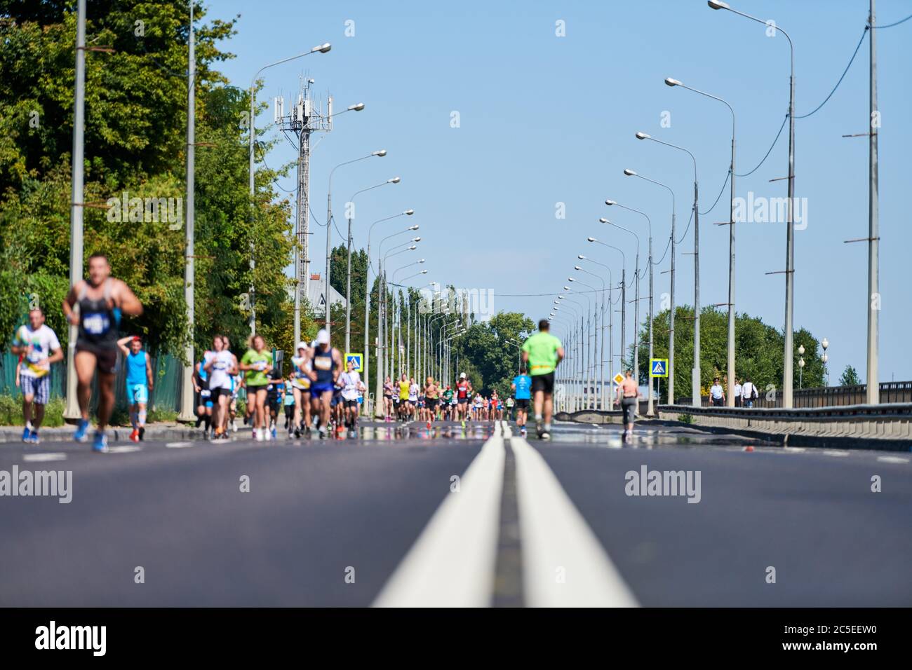Marathon runners on city road. Running competition, copy space. Street ...
