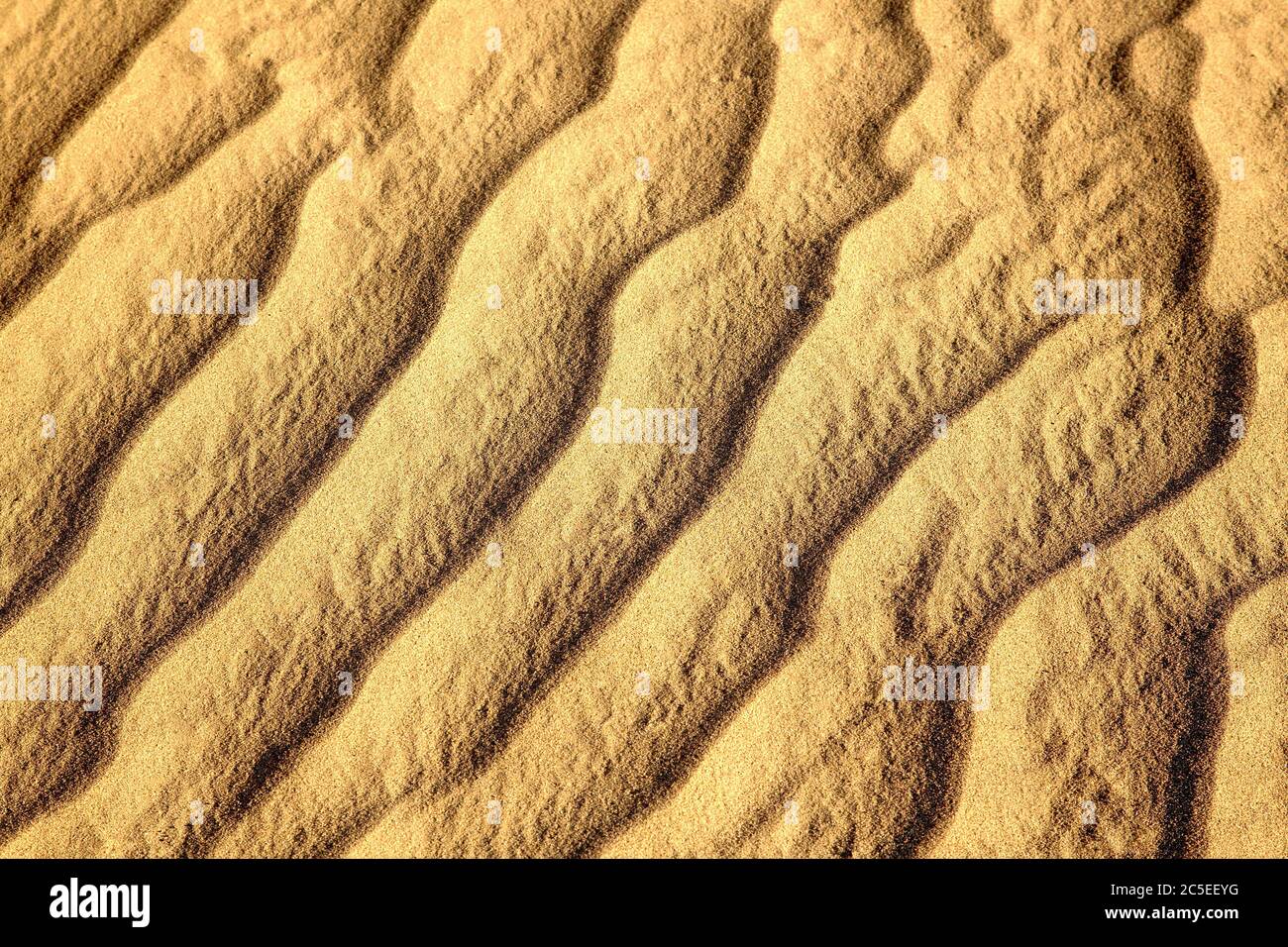 Ripples in the sand background Stock Photo - Alamy