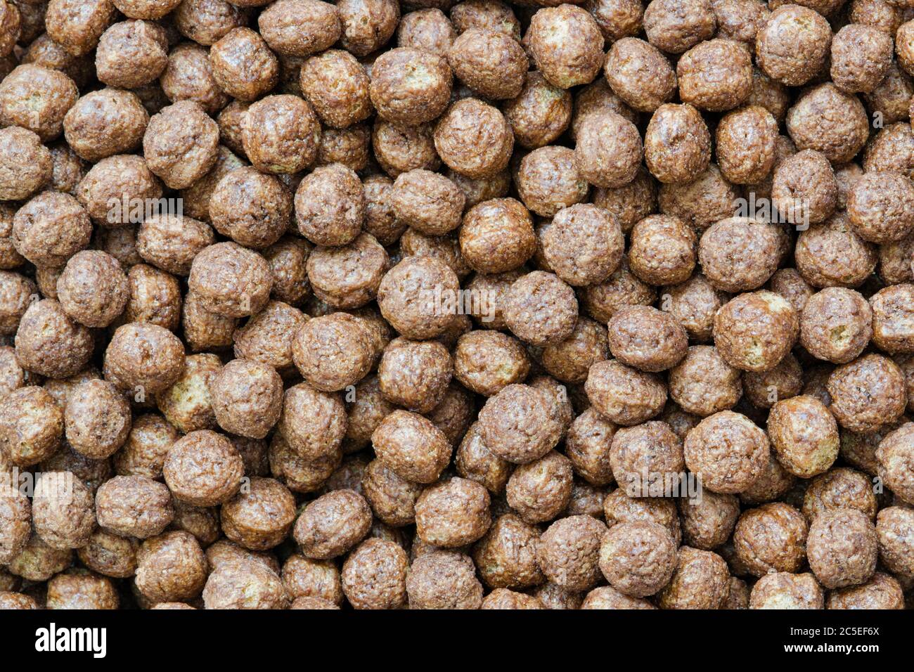 Breakfast cereal dry chocolate puff balls with no milk, full frame ...
