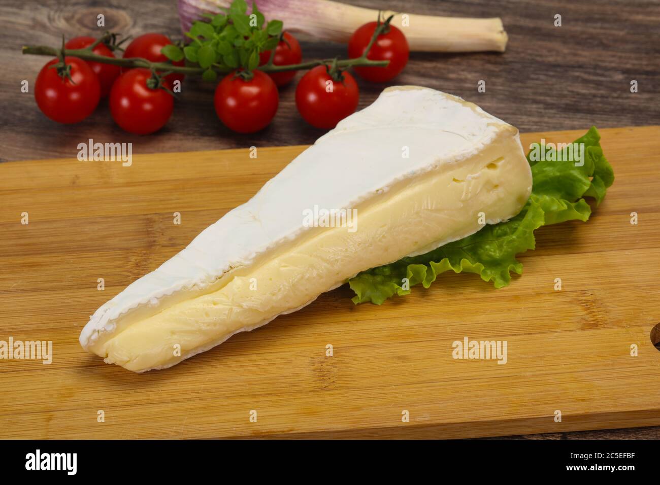 Brie cheese triangle served salad leaves Stock Photo - Alamy