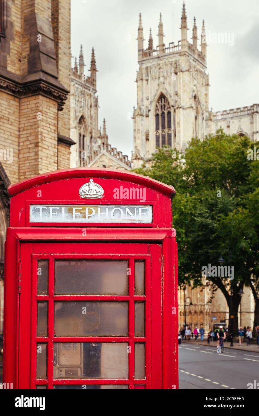 Traditional british red phone booth with the York Cathedral Stock Photo ...