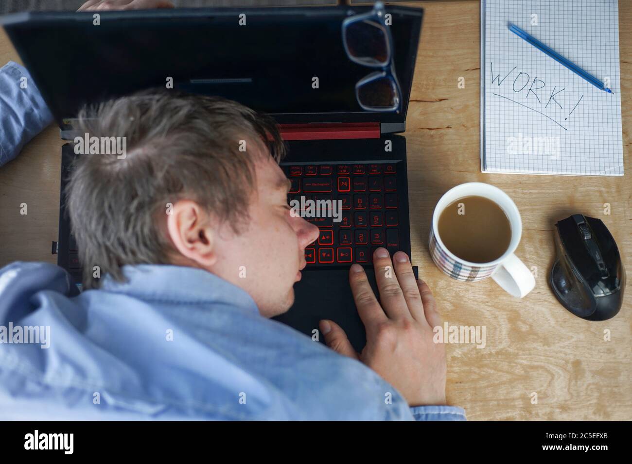 Male student sleeping on computer hi-res stock photography and images ...