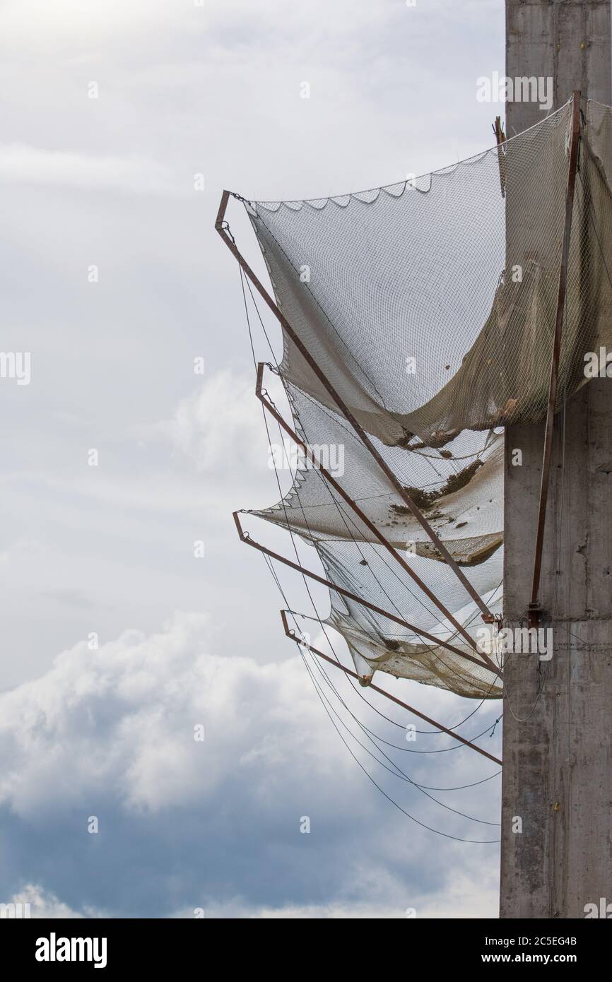 Mesh mounted on the wall of building under construction protect from ...