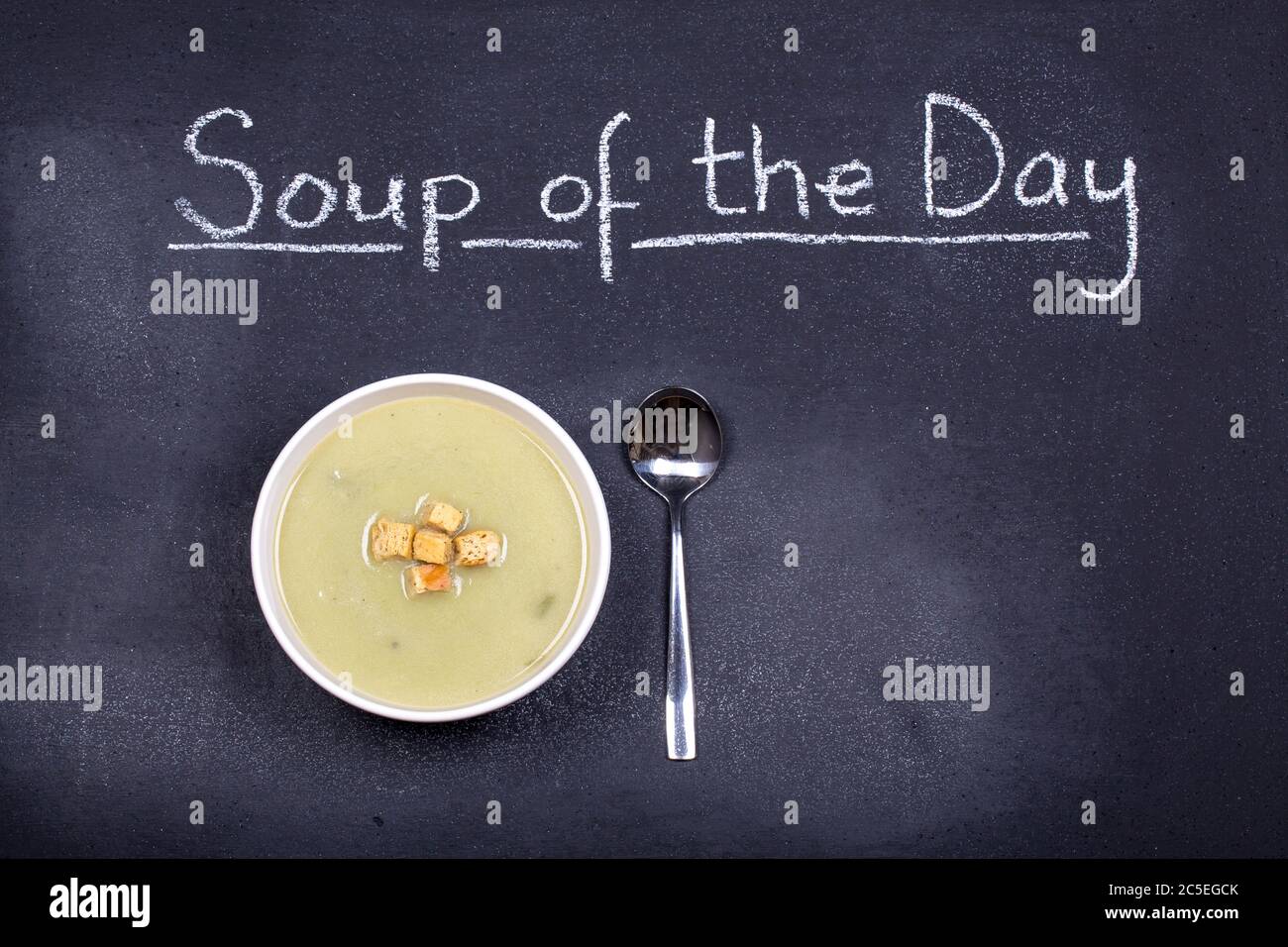 Chalkboard advertising the soup of the day, with a bowl of leek and ...