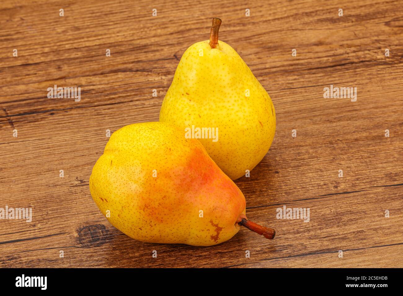 Fresh sweet yellow pear over background Stock Photo - Alamy