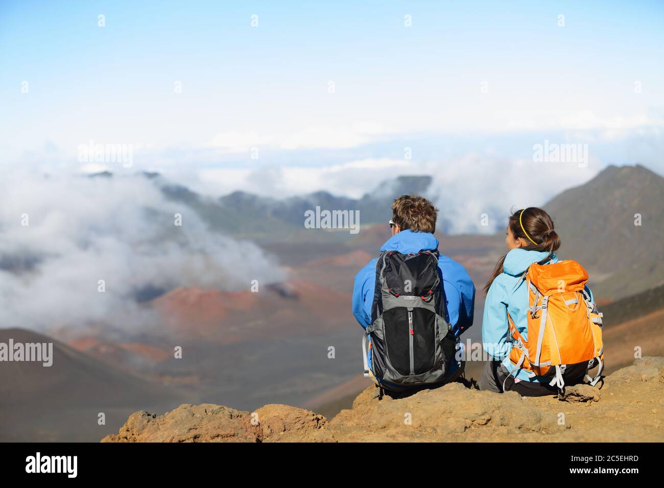 Hiking - hikers sitting enjoying view on volcano Stock Photo - Alamy